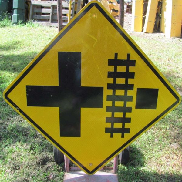 rxr-road-parallel-sign - Twin Green Traffic Signals